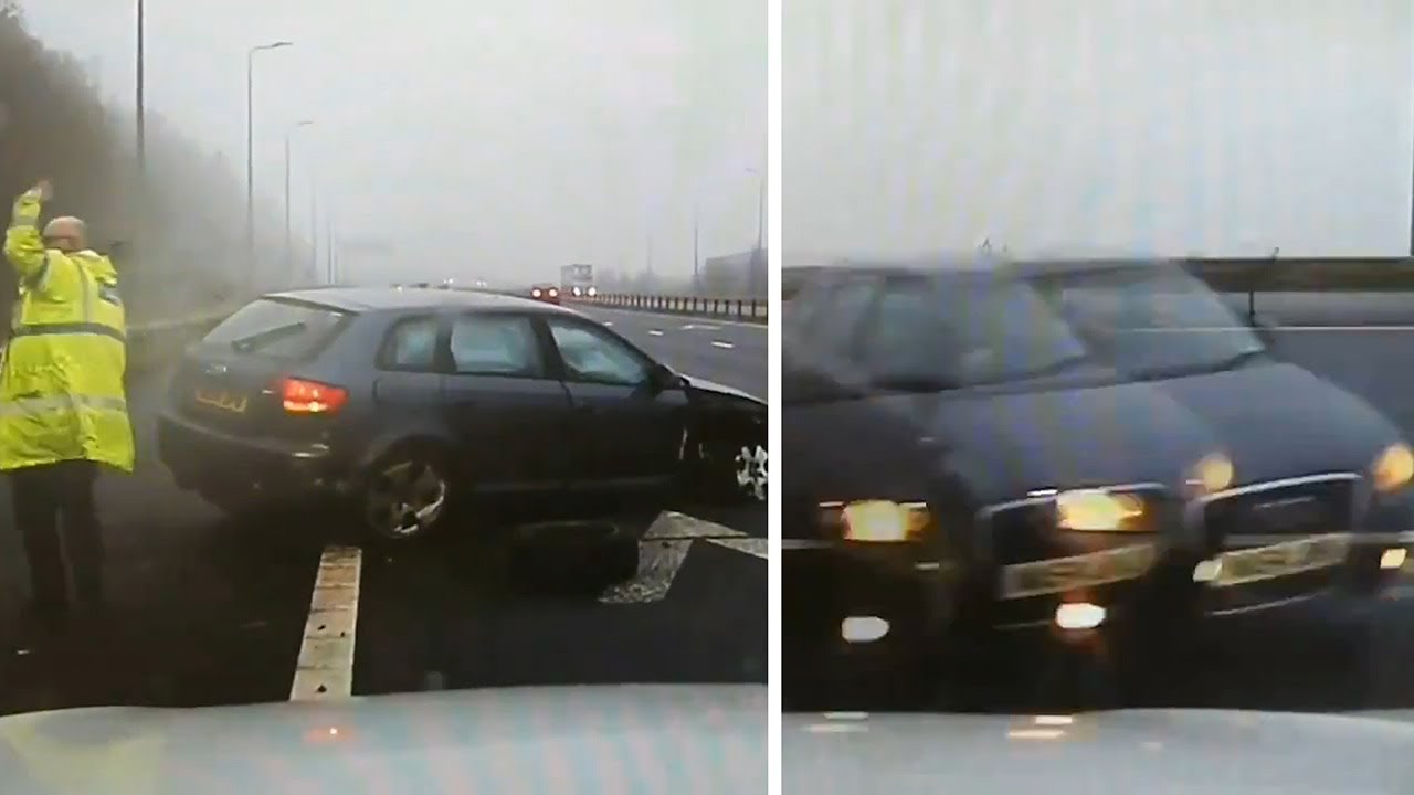 Car filmed sliding sideways on motorway in front of traffic police ...