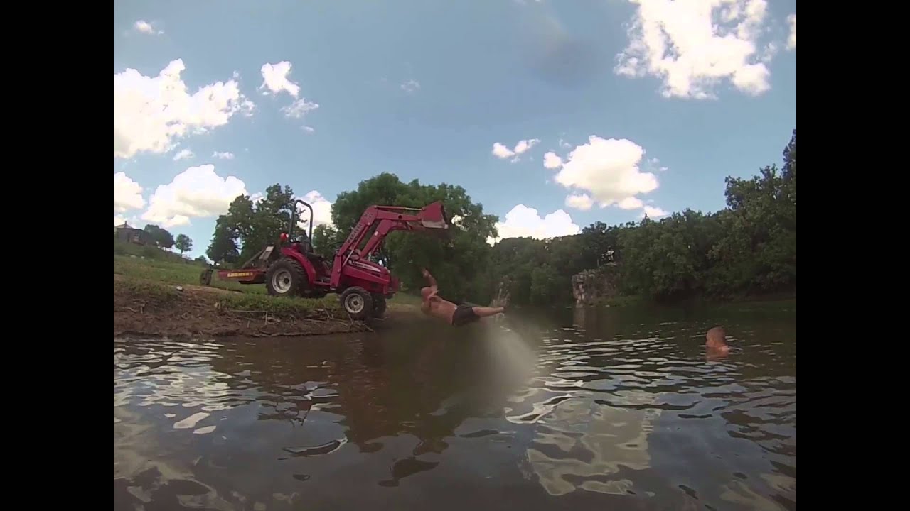 Drunk Redneck falls off a tractor into the river - YouTube