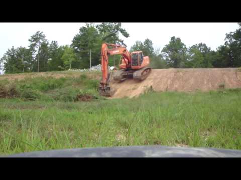 Excavator Working Hillside - YouTube