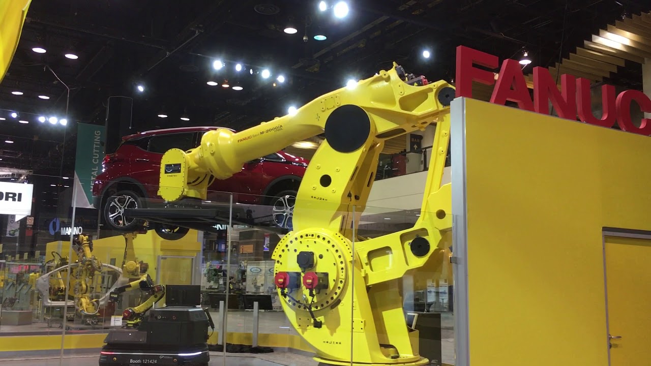 Fanuc Robot M-2000iA Manipulating Chevrolet Bolt EV at IMTS 2018 - YouTube