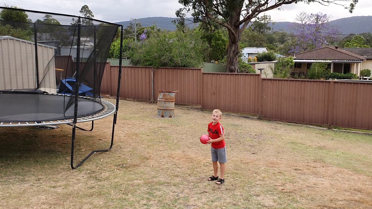 Logan kicks ball over fence - YouTube