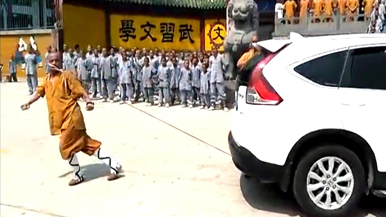 Monk Pulls Car With Only His Ear - YouTube