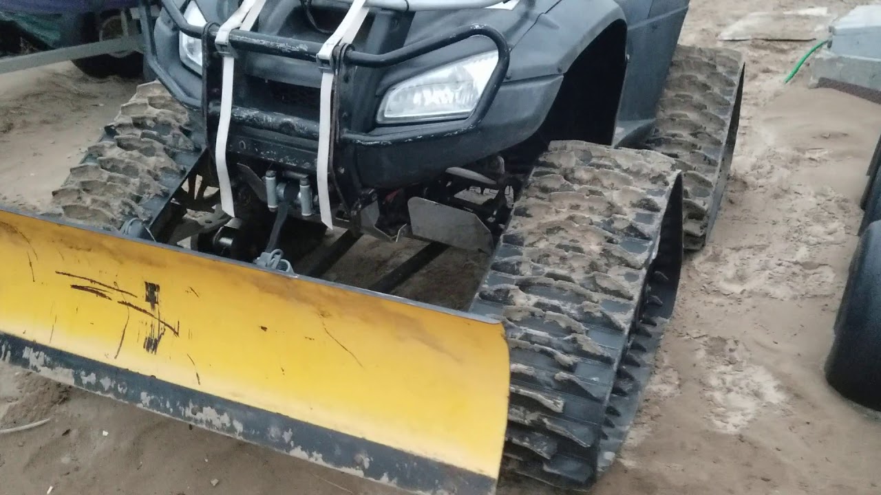 Honda rincon 4x4, w tracks, new winch rope, snowplow hooked up - YouTube