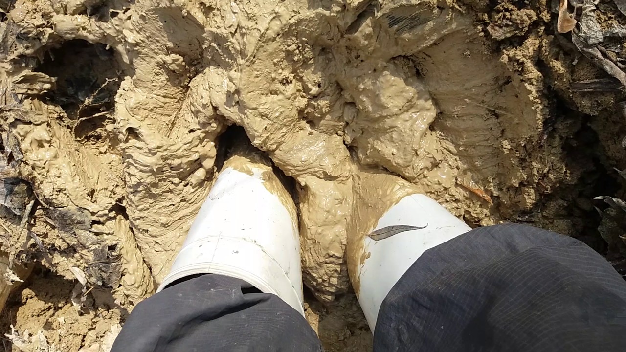 White wellies in mud. - YouTube
