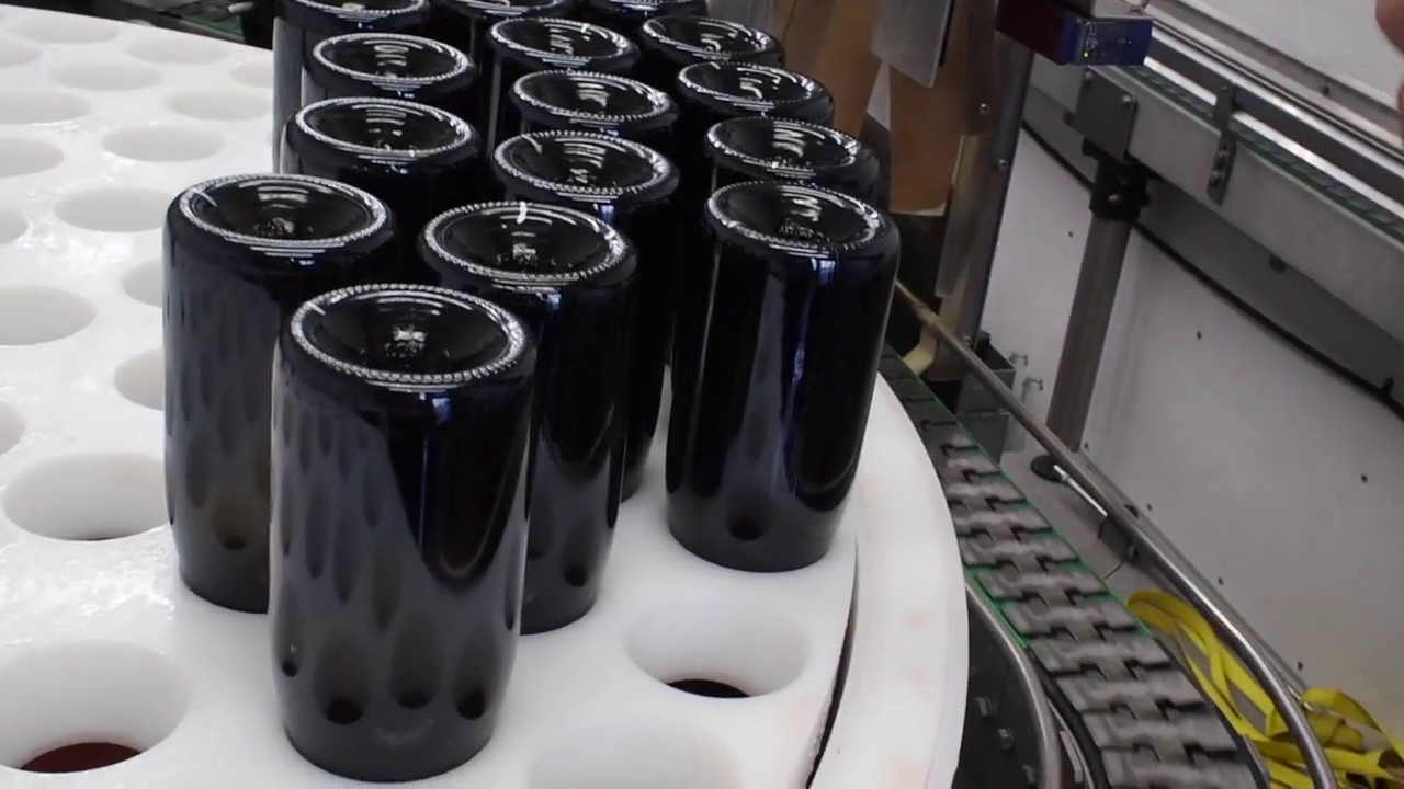 How sparkling wine is bottled: a mobile disgorging line - YouTube