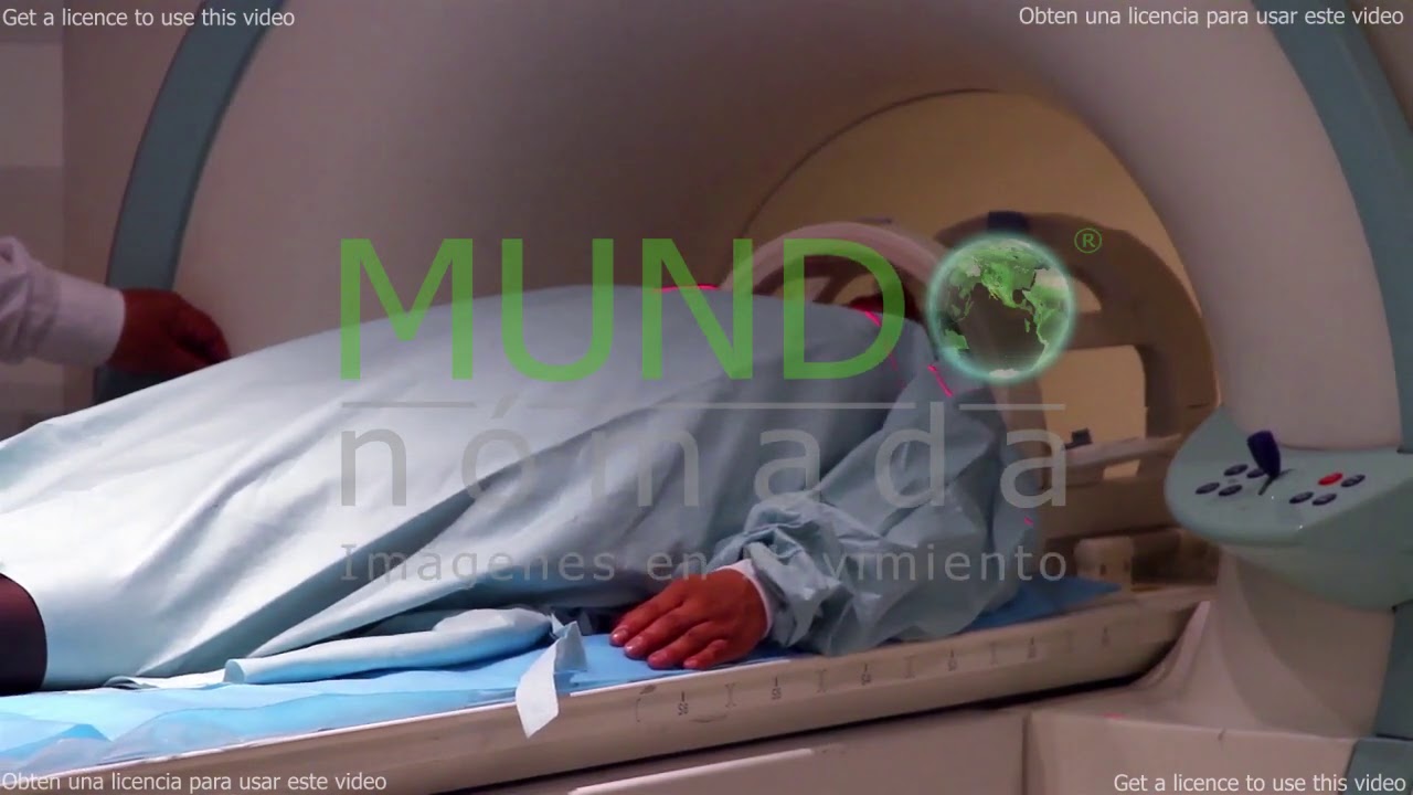 Woman inside a PET-CT doing a medical scan by a specialist. - pet05 ...