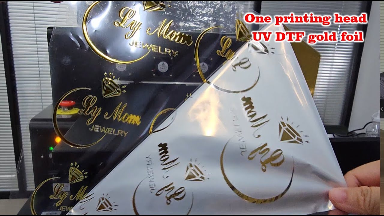 A printing head with gold foil. A printer varnish printer. - YouTube