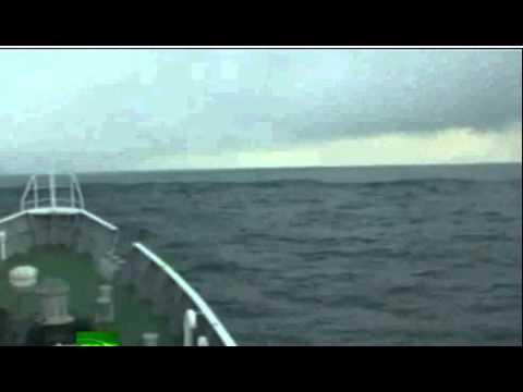 Tsunami Climbing: Incredible video of ship heading into wave in Japan ...