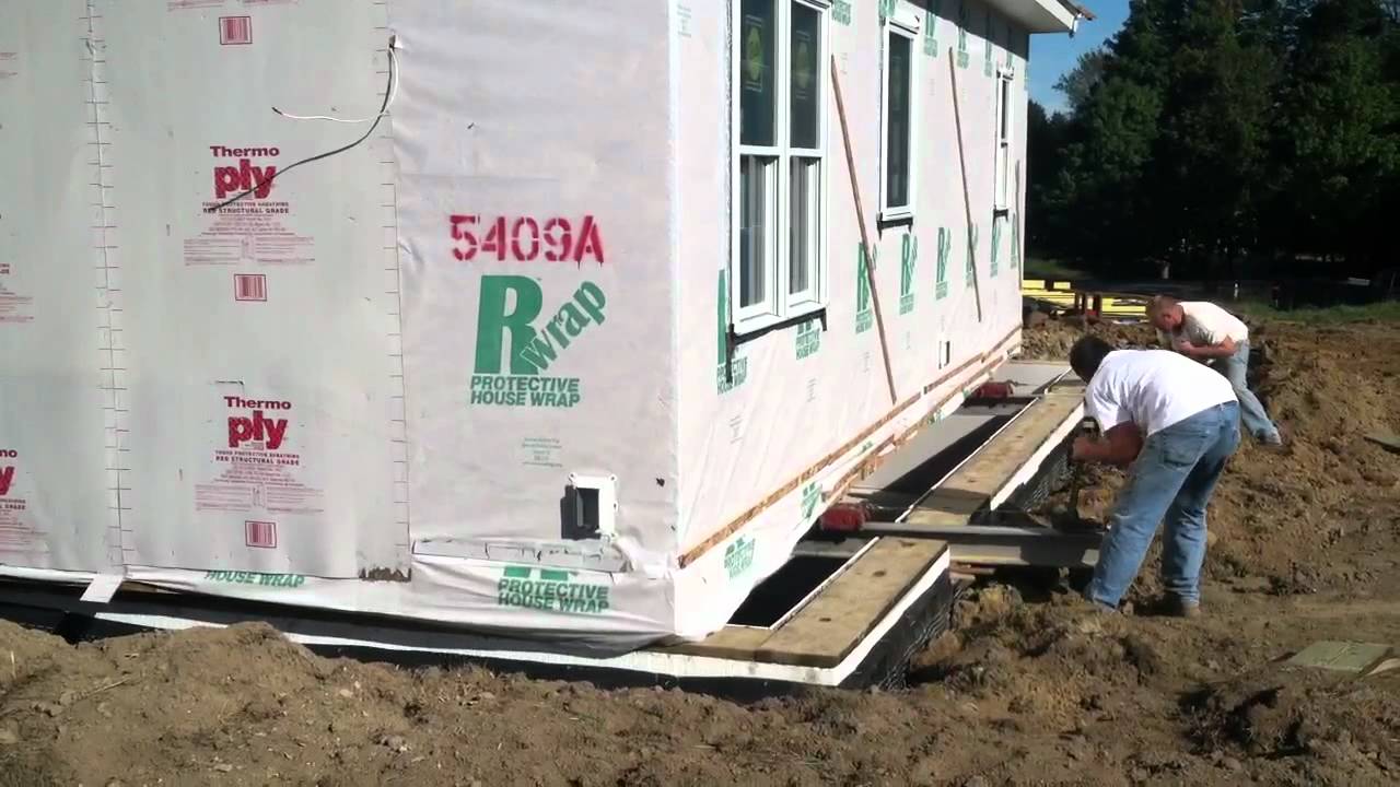 Sliding a House Module Onto the Foundation - YouTube