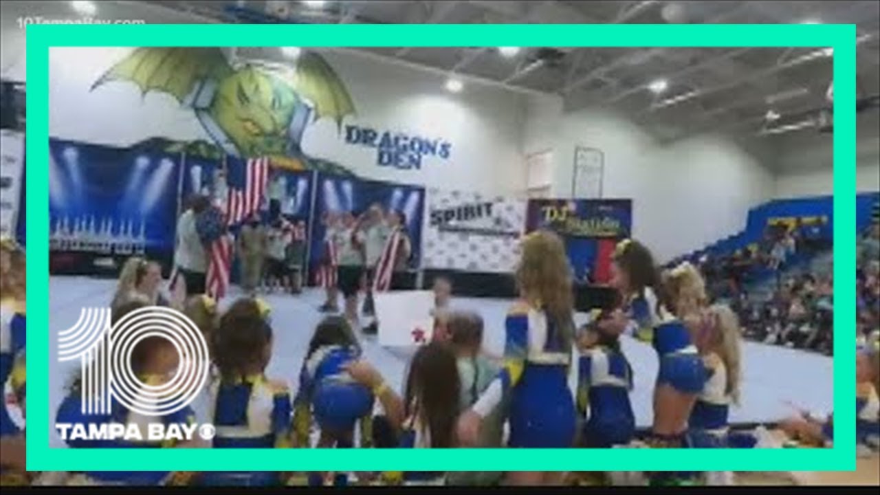 Military dad surprises daughters during cheer competition - YouTube