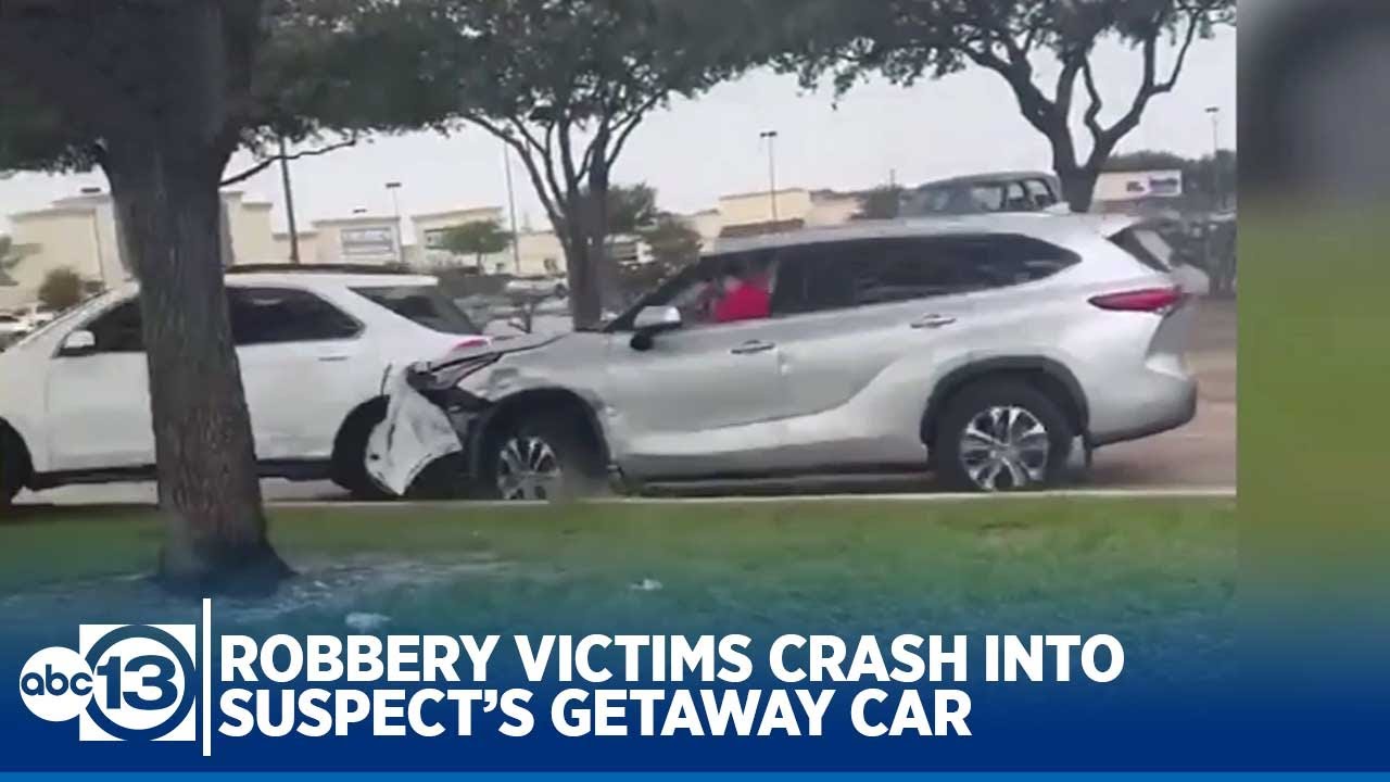 Shocking video shows moment robbery victims ram down suspect getaway ...