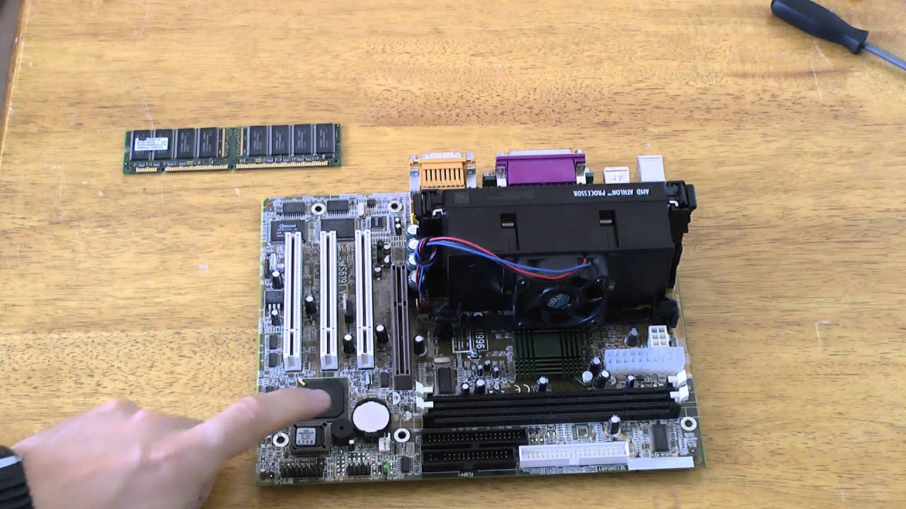 AMD/Intel slot and cartridge design with Athlon and motherboard, a ...
