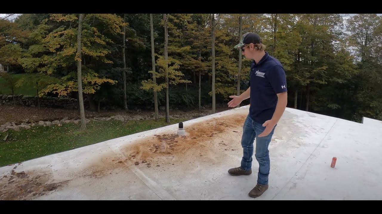 How to remove standing water on a flat roof - YouTube