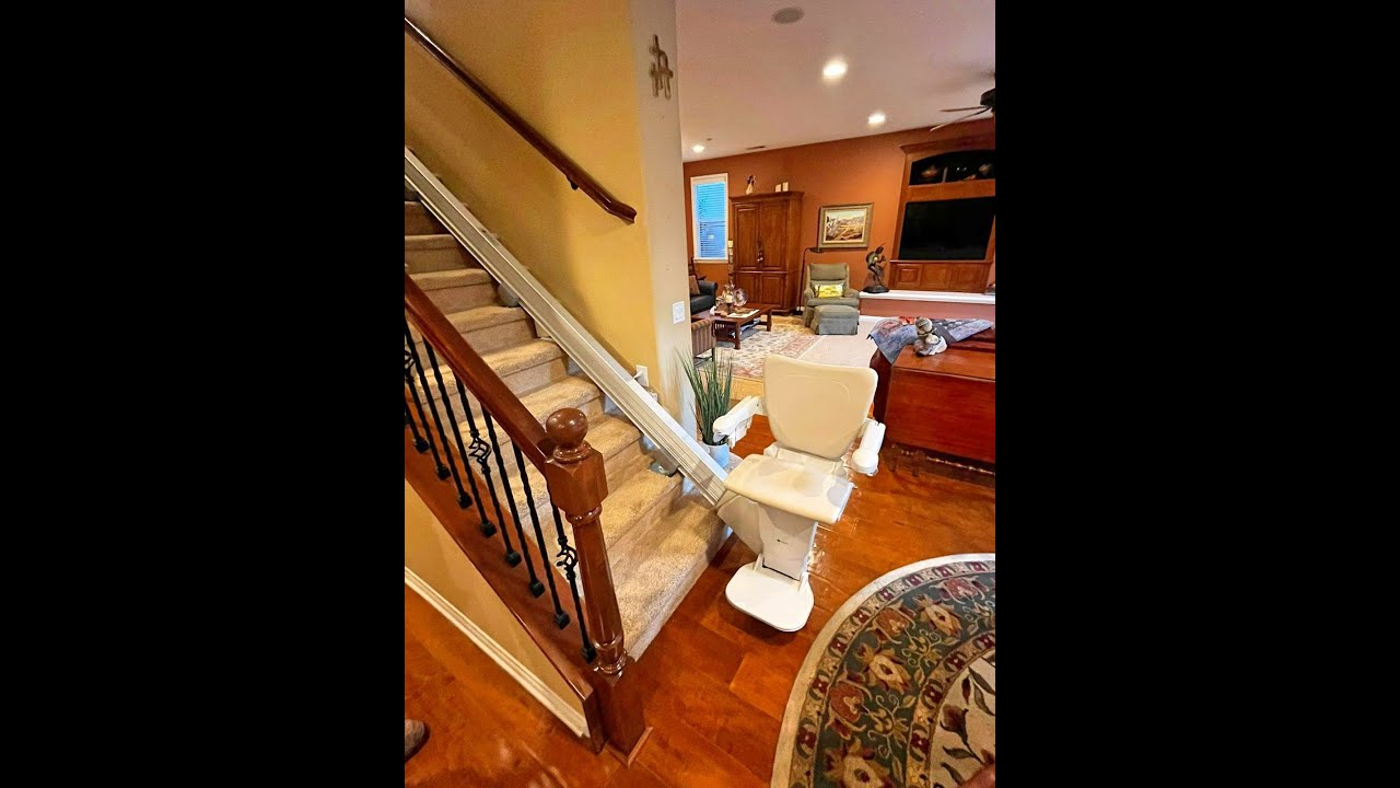 Handicare Stairlift with Slide Track - YouTube