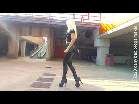 DANA LABO - the woman in black, laser shiny leggings and leather boots Pleaser, walk and dance