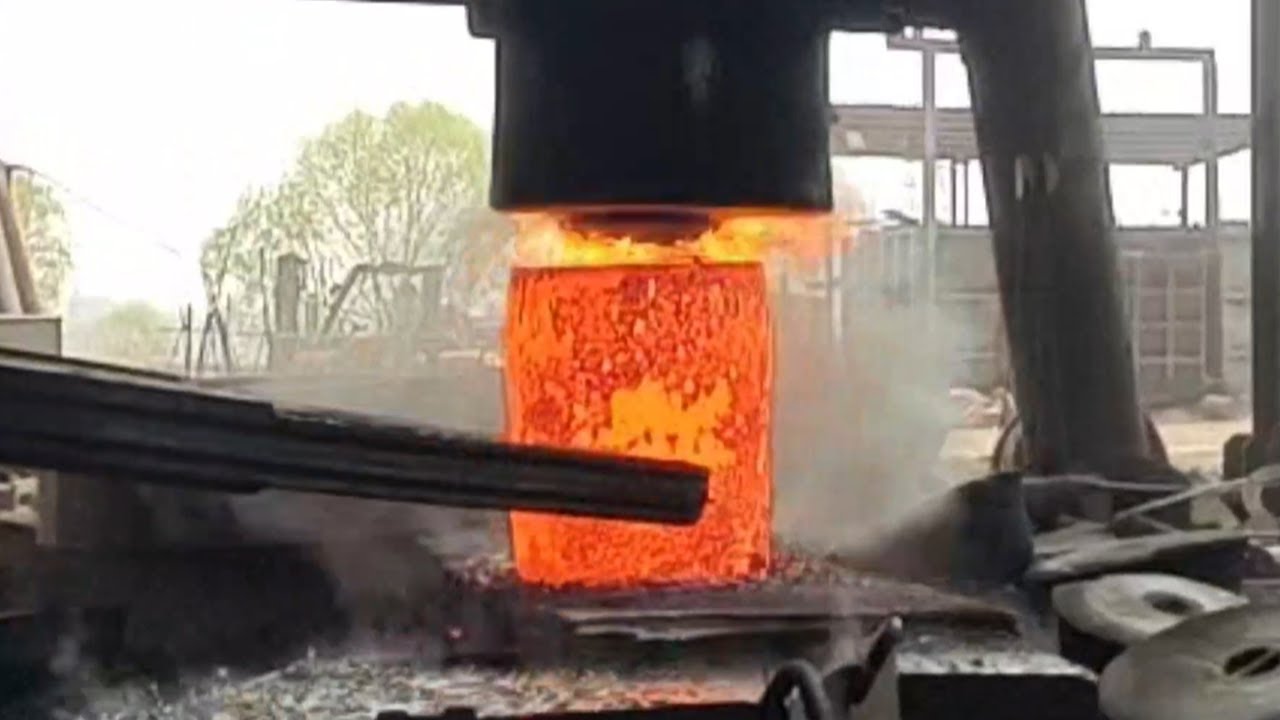 GIANT HEAVY-DUTY EQUIPMENT in Forging Plant - Iron post forging ring ...