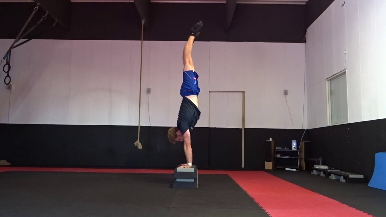 Handstand straddle press hands on platform - YouTube