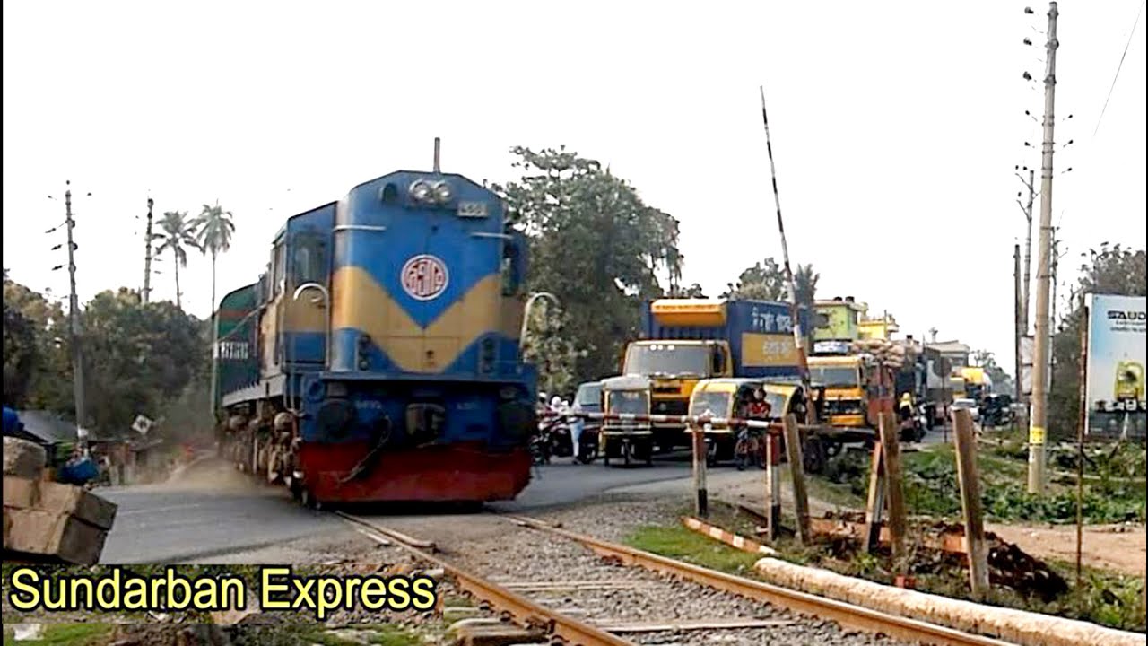Premium Train Sundarban Express Passing a Busy Rail Gage of Bangladesh ...