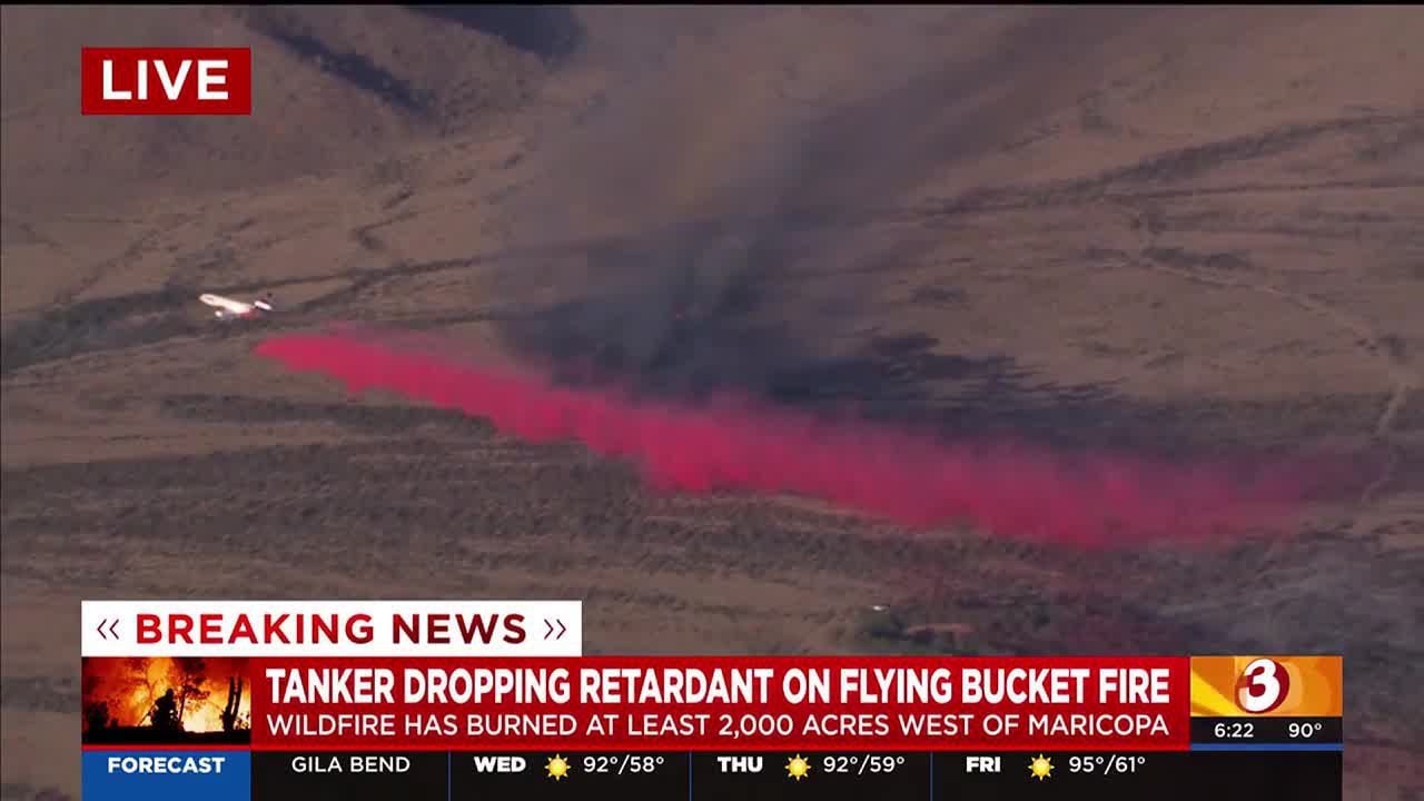 Tanker dropping retardant on Flying Bucket Fire burning west of ...