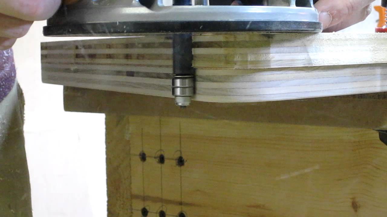 Using the router and a trim bit to make a copy of one side panel - YouTube