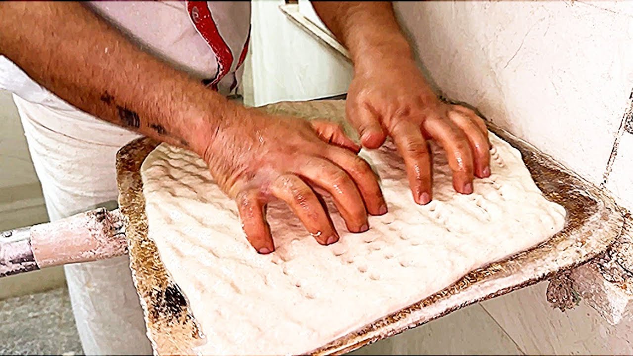 Baking stone bread in Iran. The most delicious bread in the world - YouTube