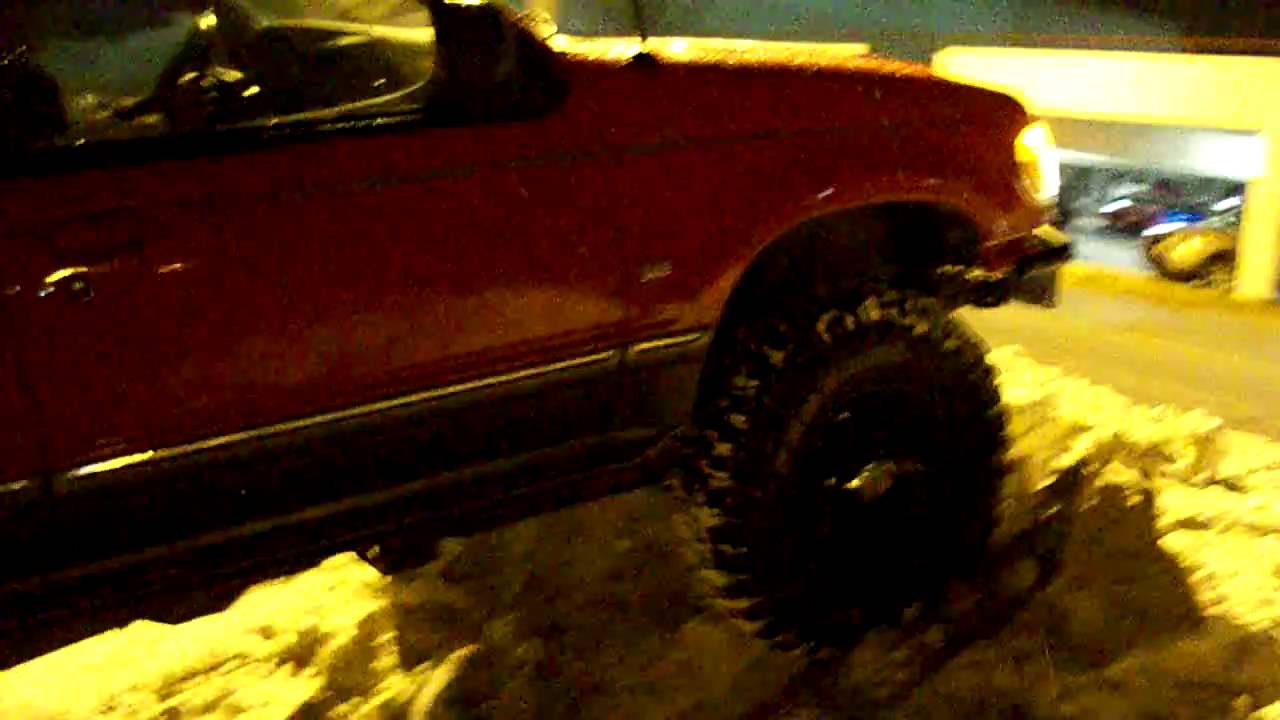 crawling up a snow pile on ice. lifted explorer - YouTube