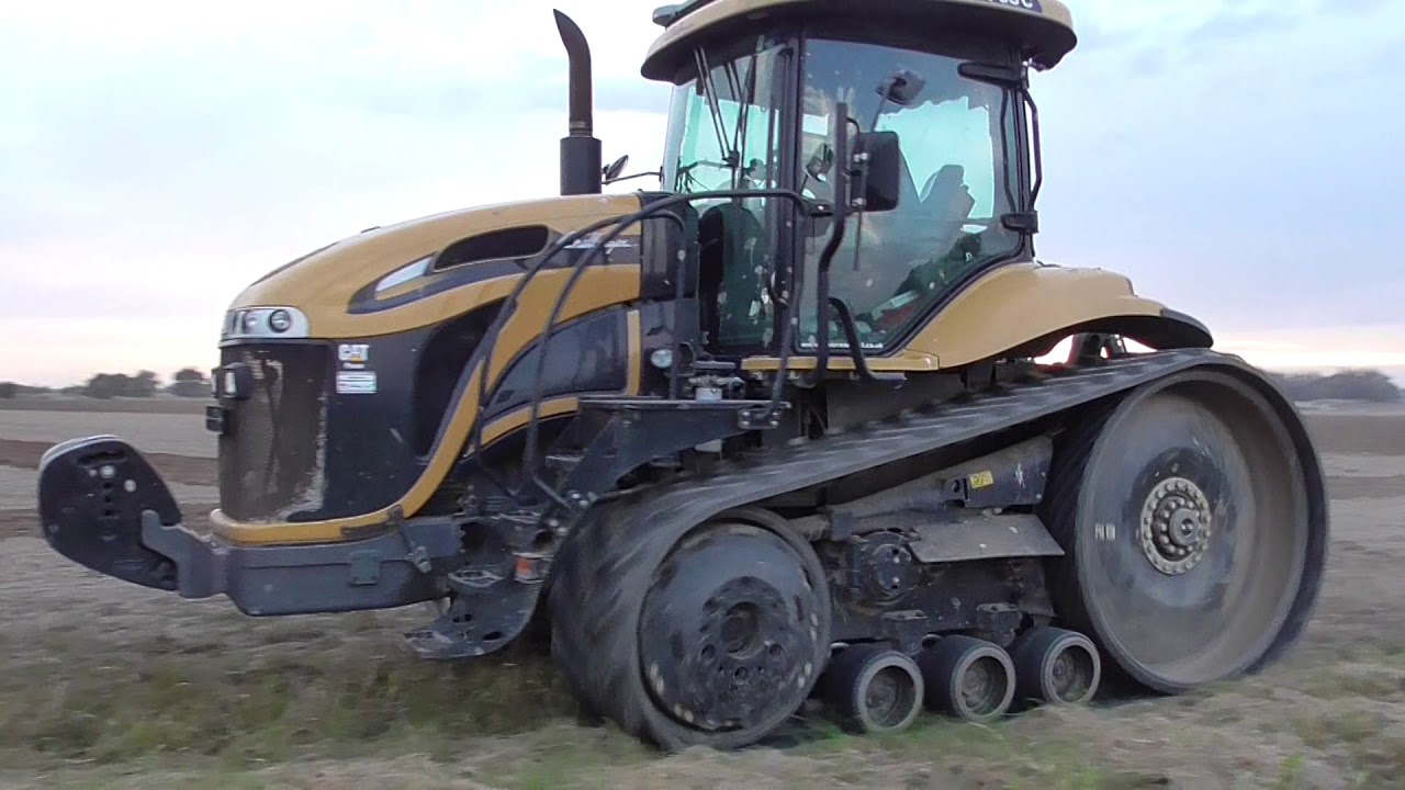 Caterpillar Challenger MT 765C pulling a Progressive heavy cultivator ...