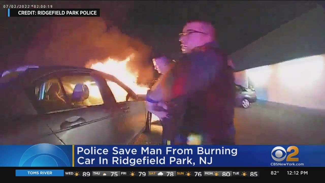 Police save man from burning car - YouTube
