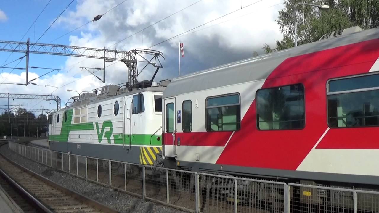 Finnish Sr1 electric locomotive with reserve set train in traffic ...