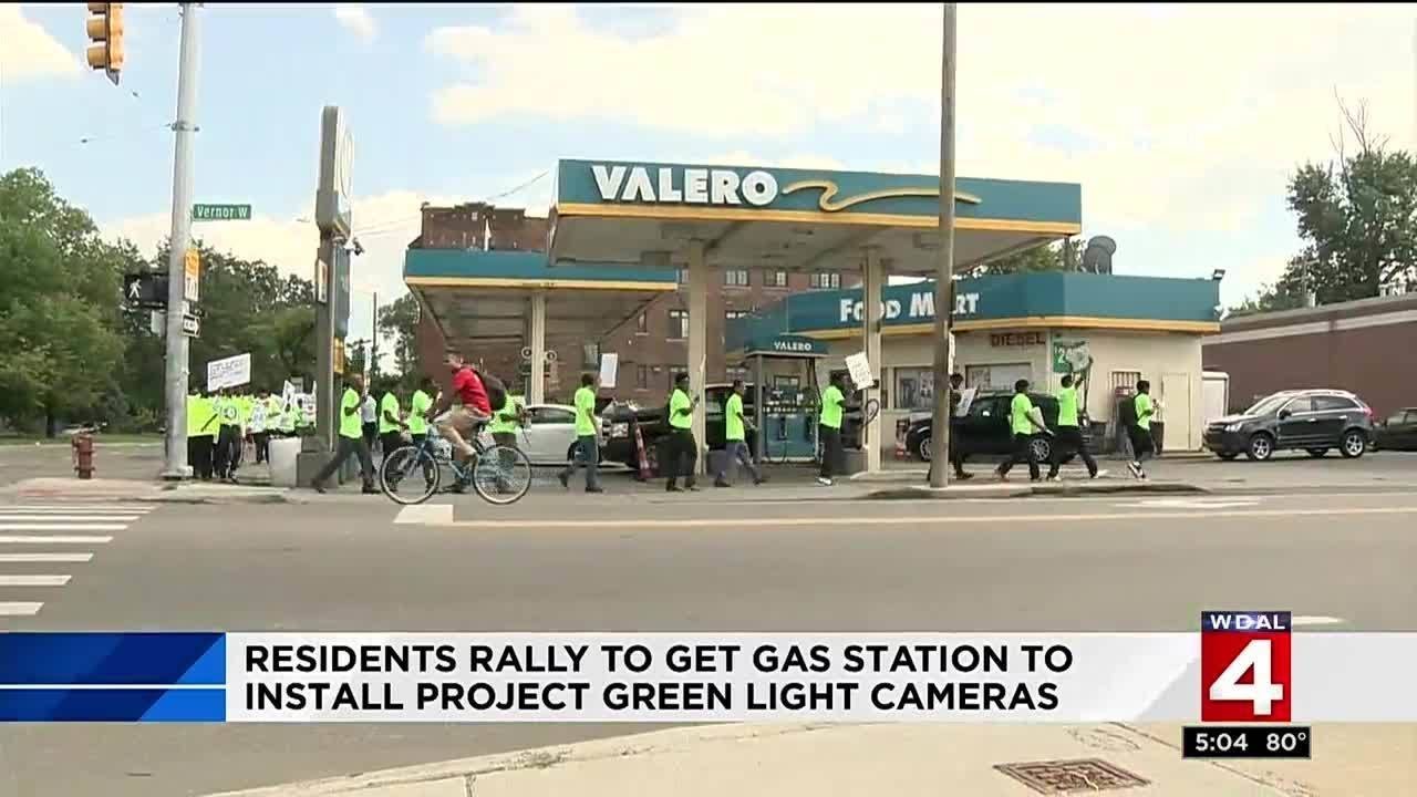 Detroit residents rally for Green Light cameras at gas station - YouTube