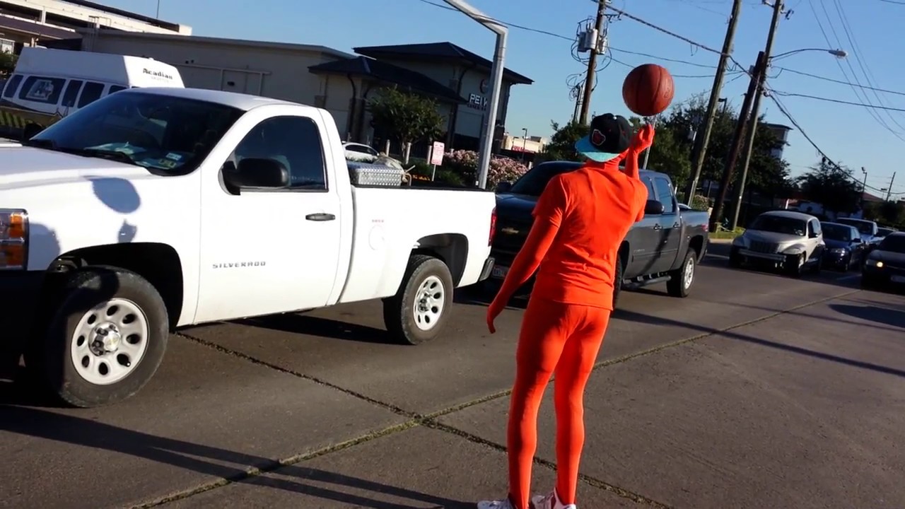 Man Dressed in Orange Jump Suit, Basketball Spinning in Traffic - YouTube