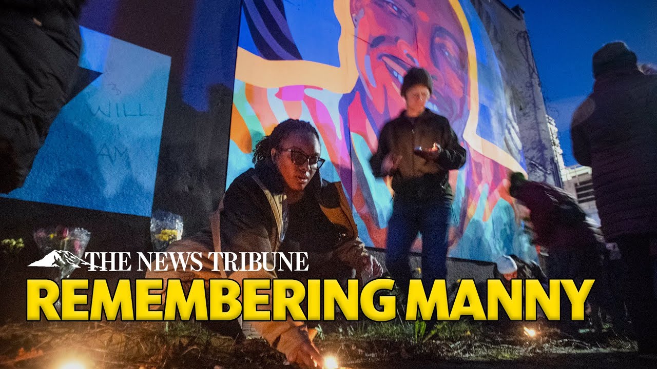 Family, Friends and Supporters of Manny Ellis Bring Flowers and Candles ...