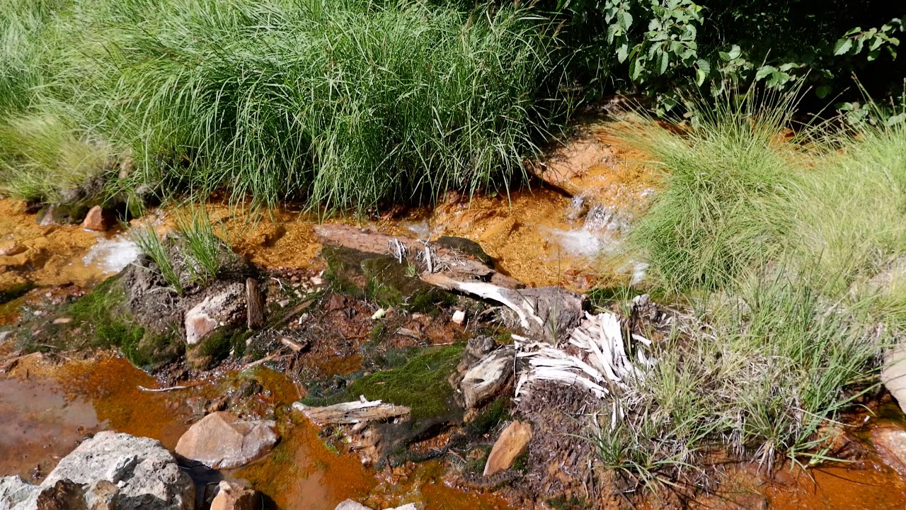 A stream contaminated by mine waste runoff near Empire in Clear Creek ...