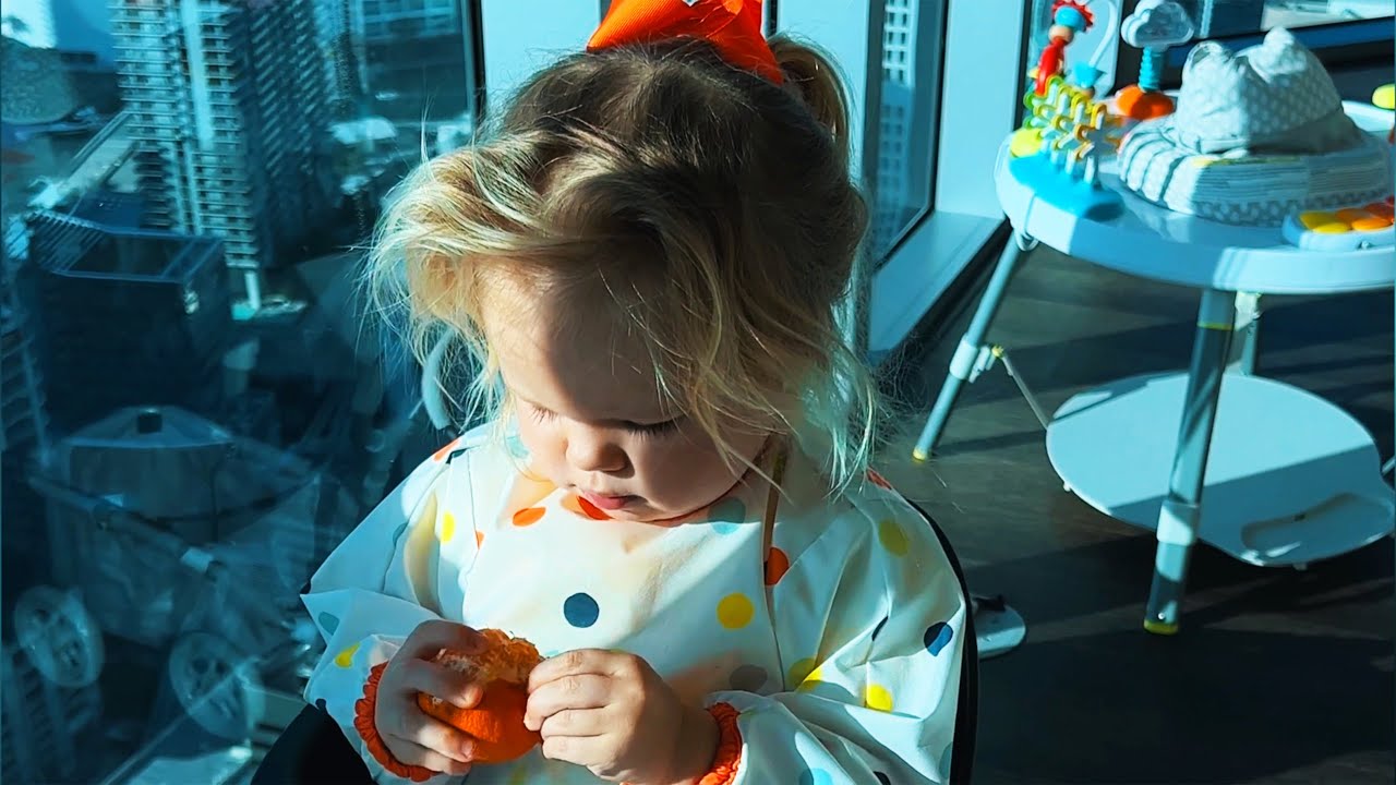 Little toddler Naomi eats tangerine - YouTube