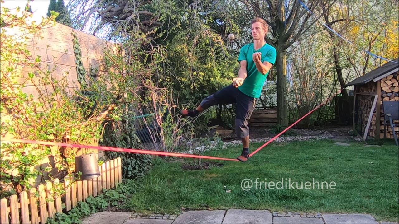 juggling while walking a slackline forward and backwards - YouTube