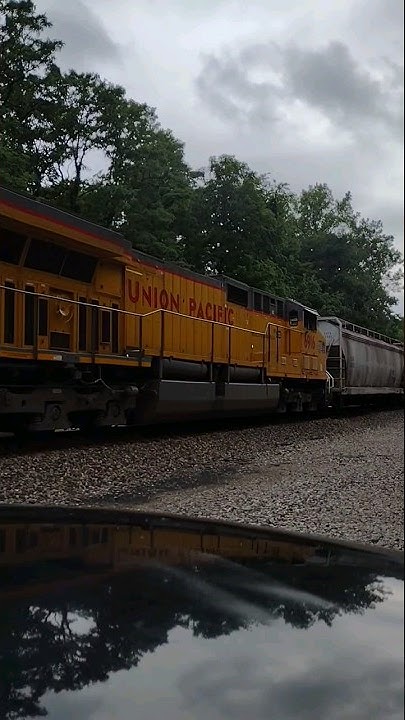 NS 4053 and UP 6916 roar by! - YouTube