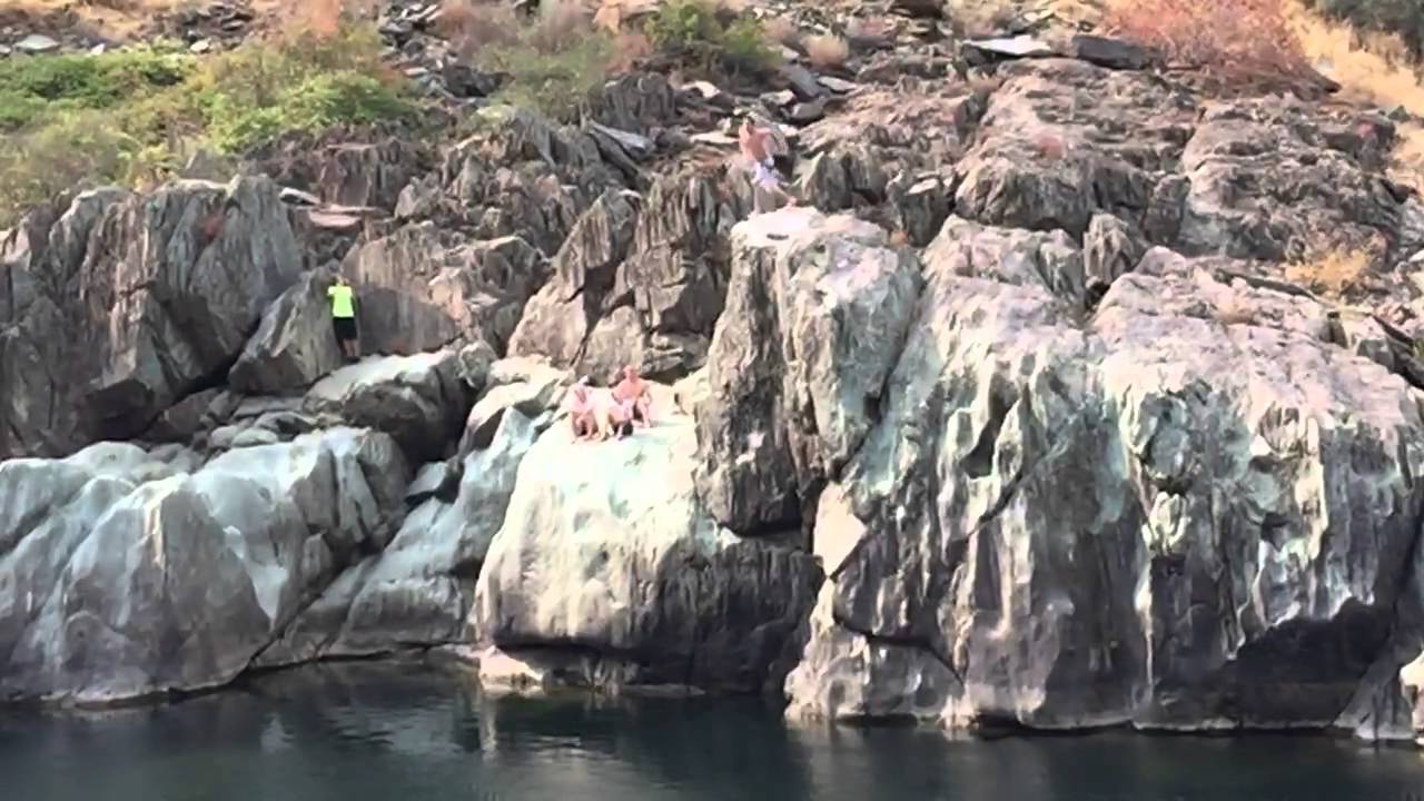 SloMo of guy doing flip off cliff - YouTube