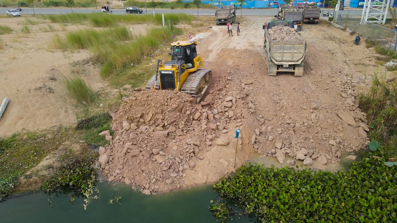 Great job Action Making Road Cross the Water By Dozer Pushing Stone ...