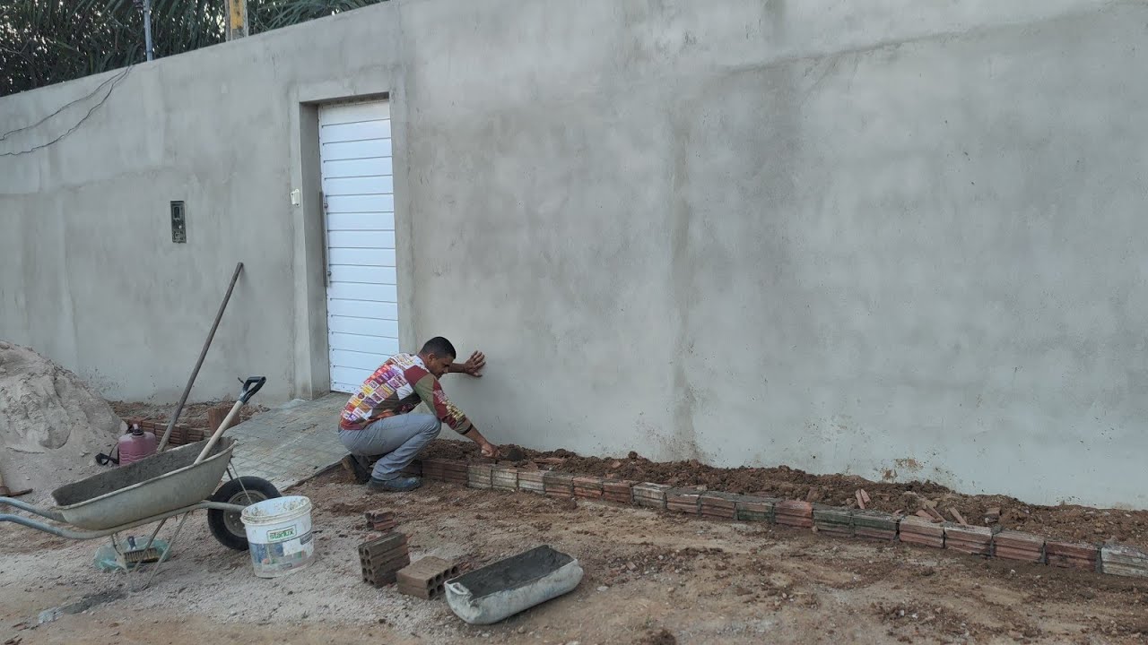 Izael e eu, Finalizamos os acabamentos do muro.e fizemos a calçada ...