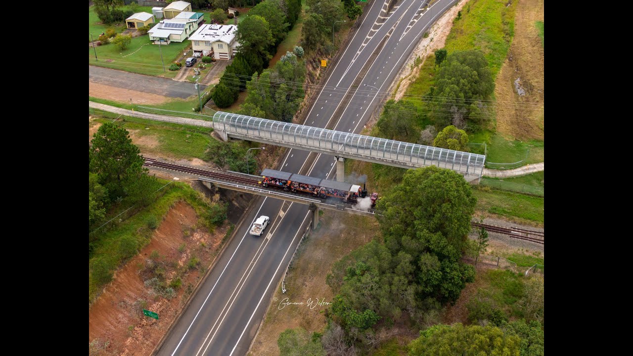 Mary Ann steam train crossing Bruce Highway bridge near Maryborough ...
