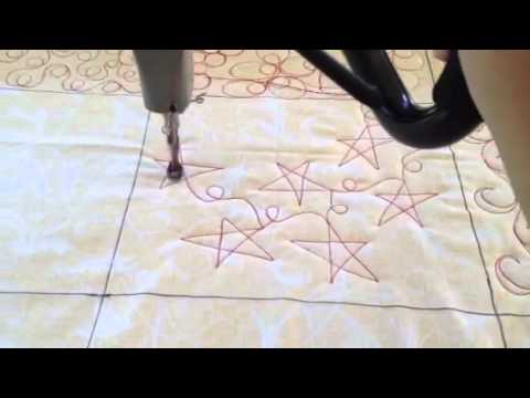 Free motion machine quilting a star design - YouTube