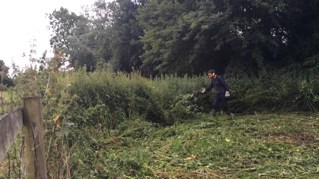 Cutting down nettles with a power scythe mower - YouTube
