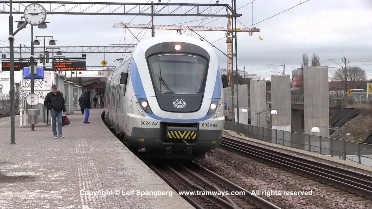 SL X60 commuter trains at Årstaberg station, Stockholm - YouTube