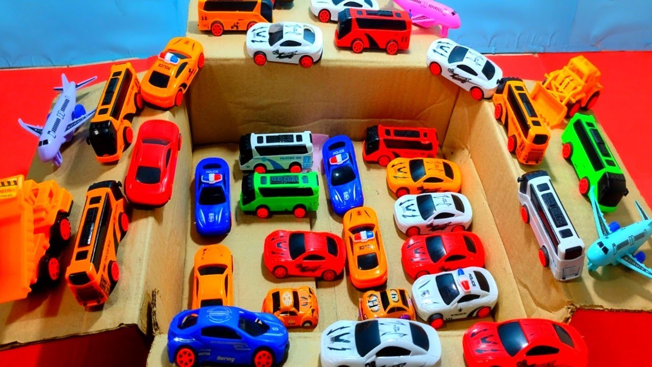 Reviewing a Box Full of Toy Cars, Bus, and Police Car Toys - YouTube