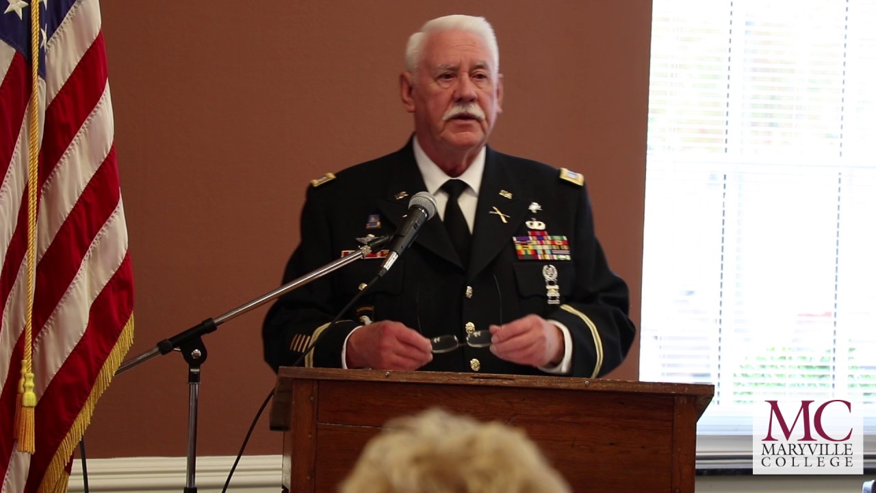 Retired U.S. Army Captain Claude Abbott speaking at a luncheon on ...