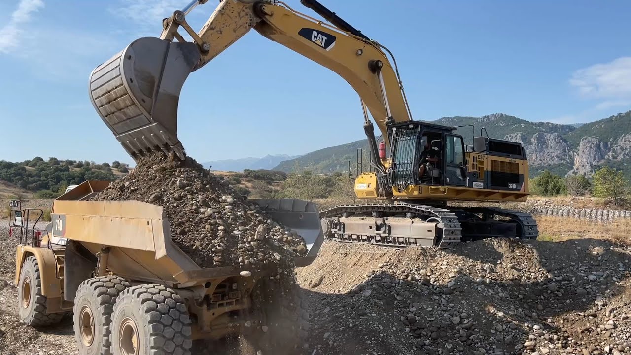 Caterpillar 374D Excavator Loading Caterpillar 740 And Volvo A40D ...