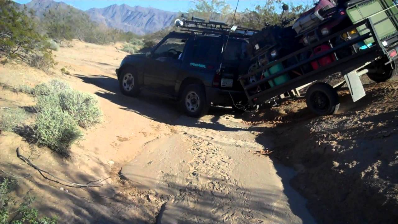 Tracker pulling 2 quad trailer in desert - YouTube