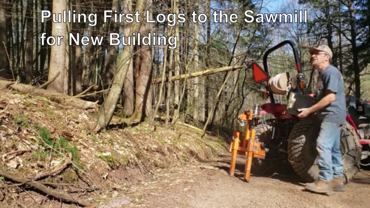 Pulling First Logs to the Sawmill for New Building - YouTube