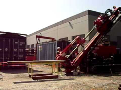 Hands-free rod handling developed for sonic drill rigs. - YouTube