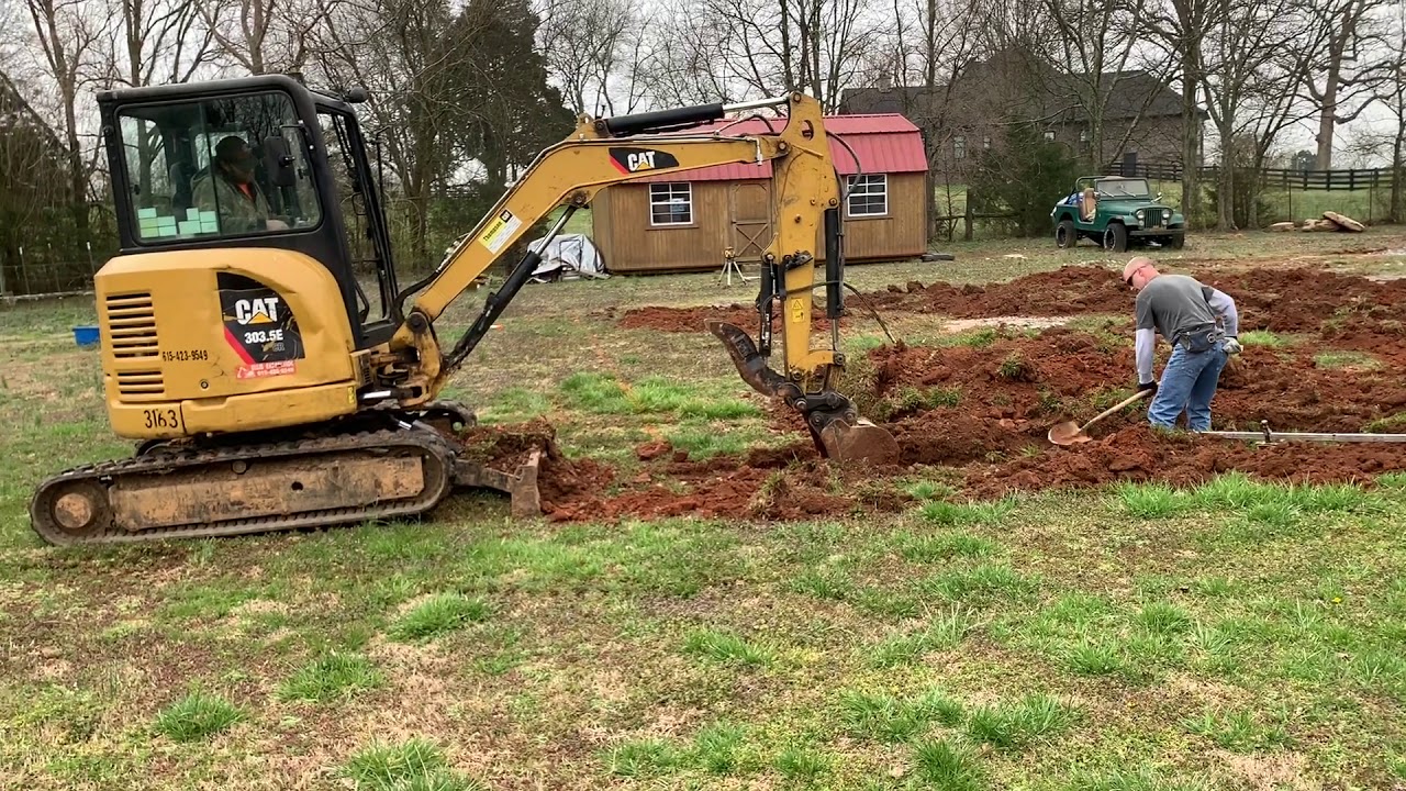 Digging A Small foundation with a 303.5 - YouTube